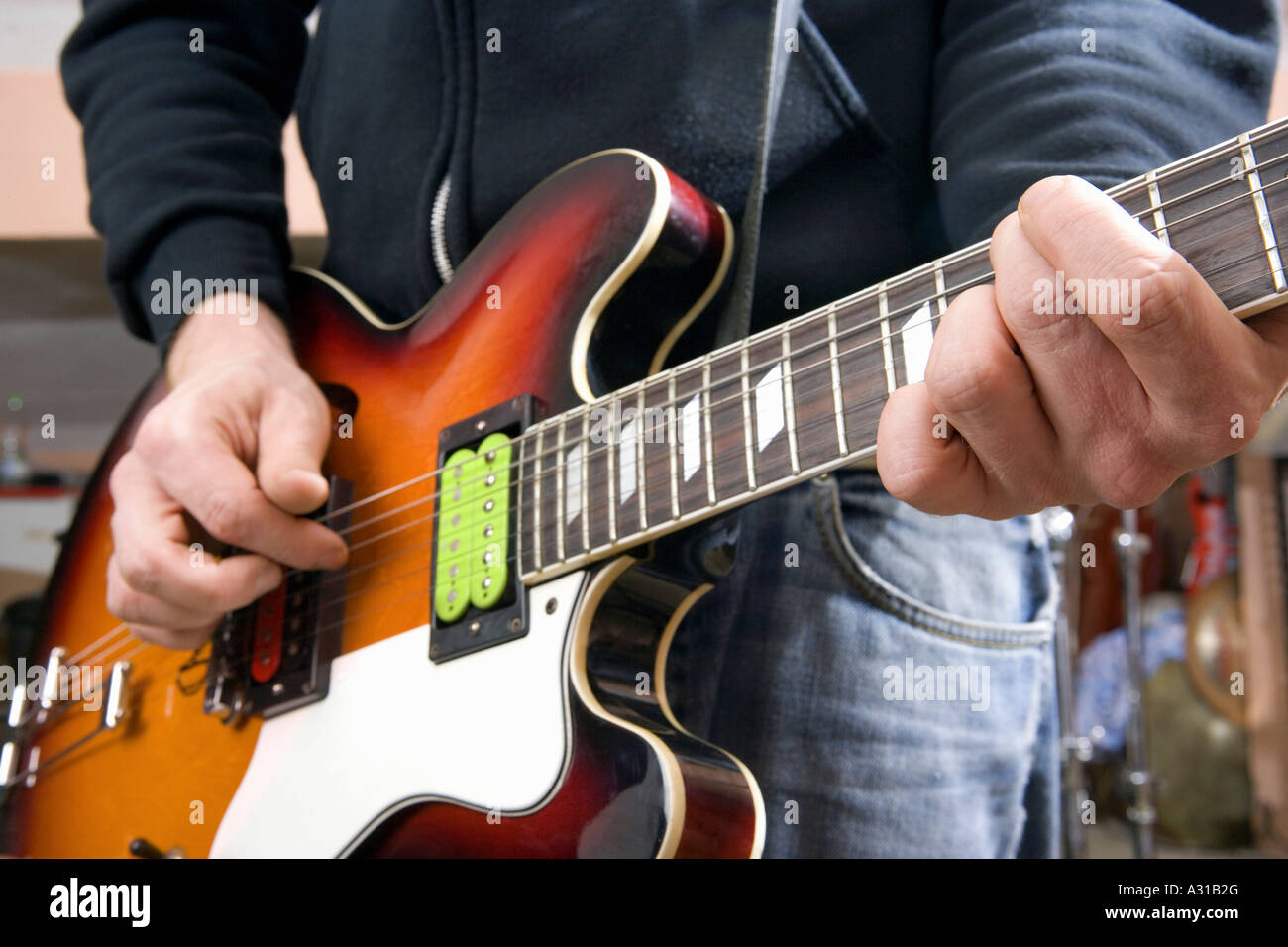 Close up of guitarist playing guitar Stock Photo - Alamy