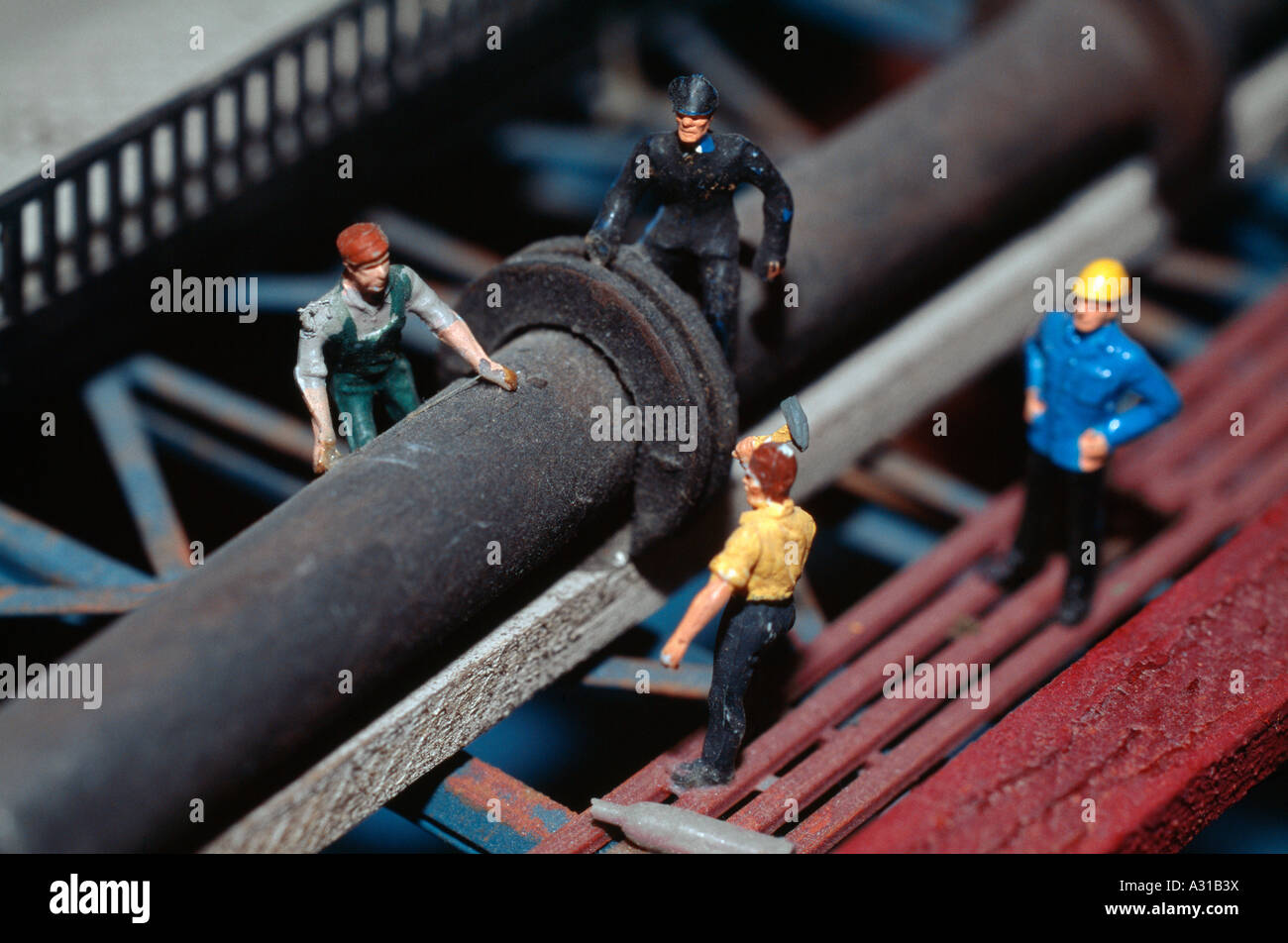 Model of men working on pipeline Stock Photo - Alamy