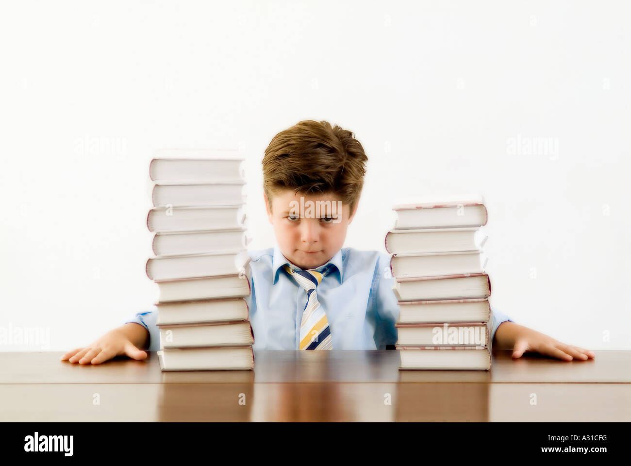 Child with piles of books Stock Photo - Alamy