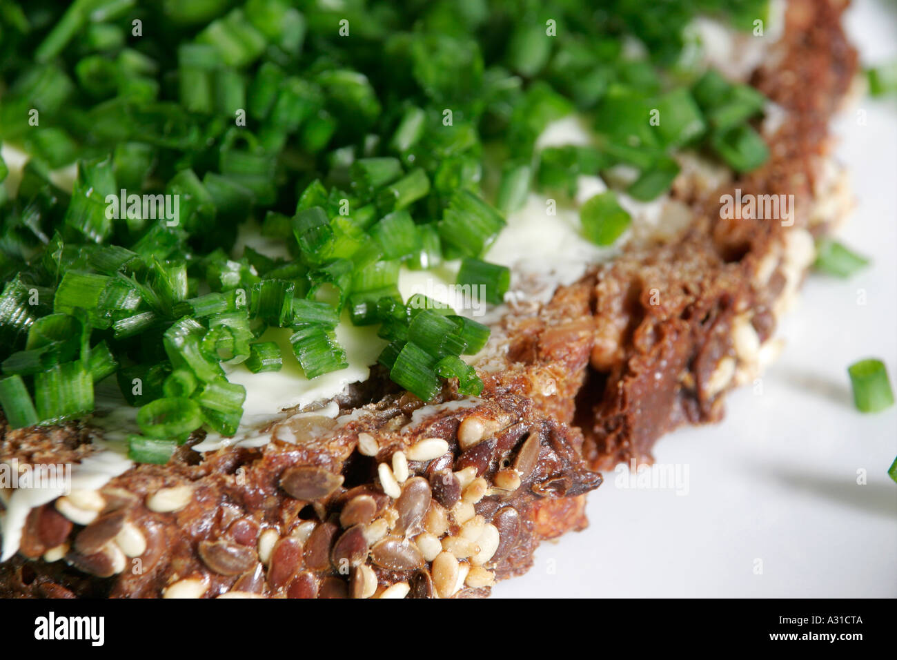 Small pieces of chive gathered around the brown bread Stock Photo - Alamy