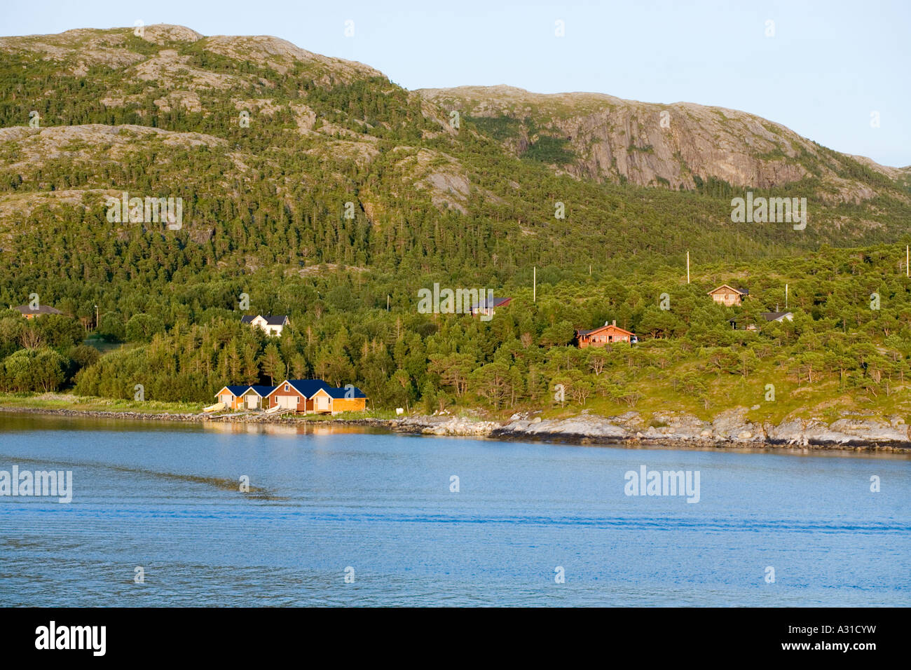 Evening sunlight on boat houses northeast of Rorvik Norway Stock Photo ...