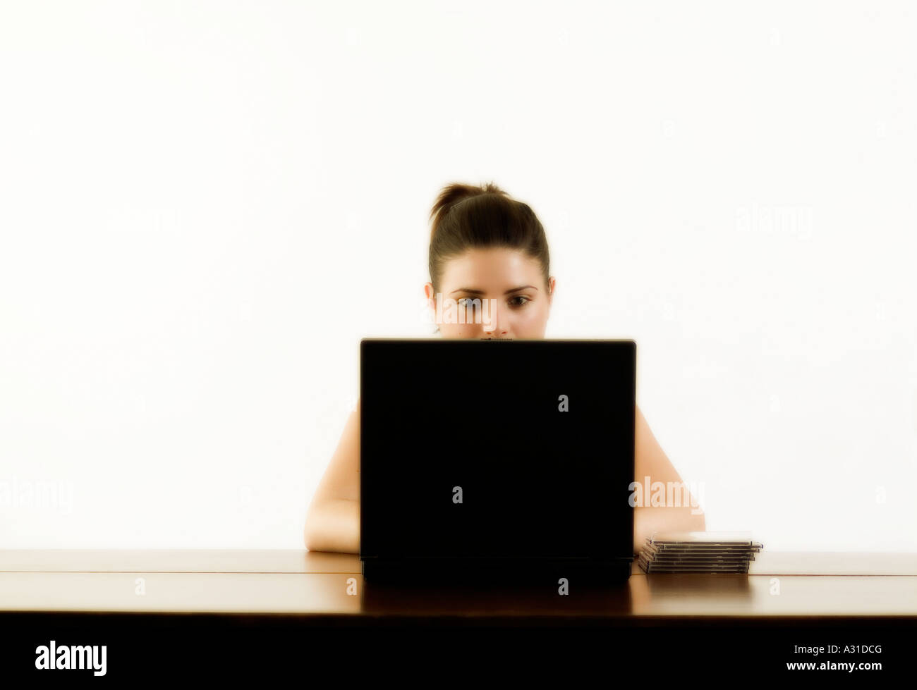 Young girl working with laptop Stock Photo - Alamy