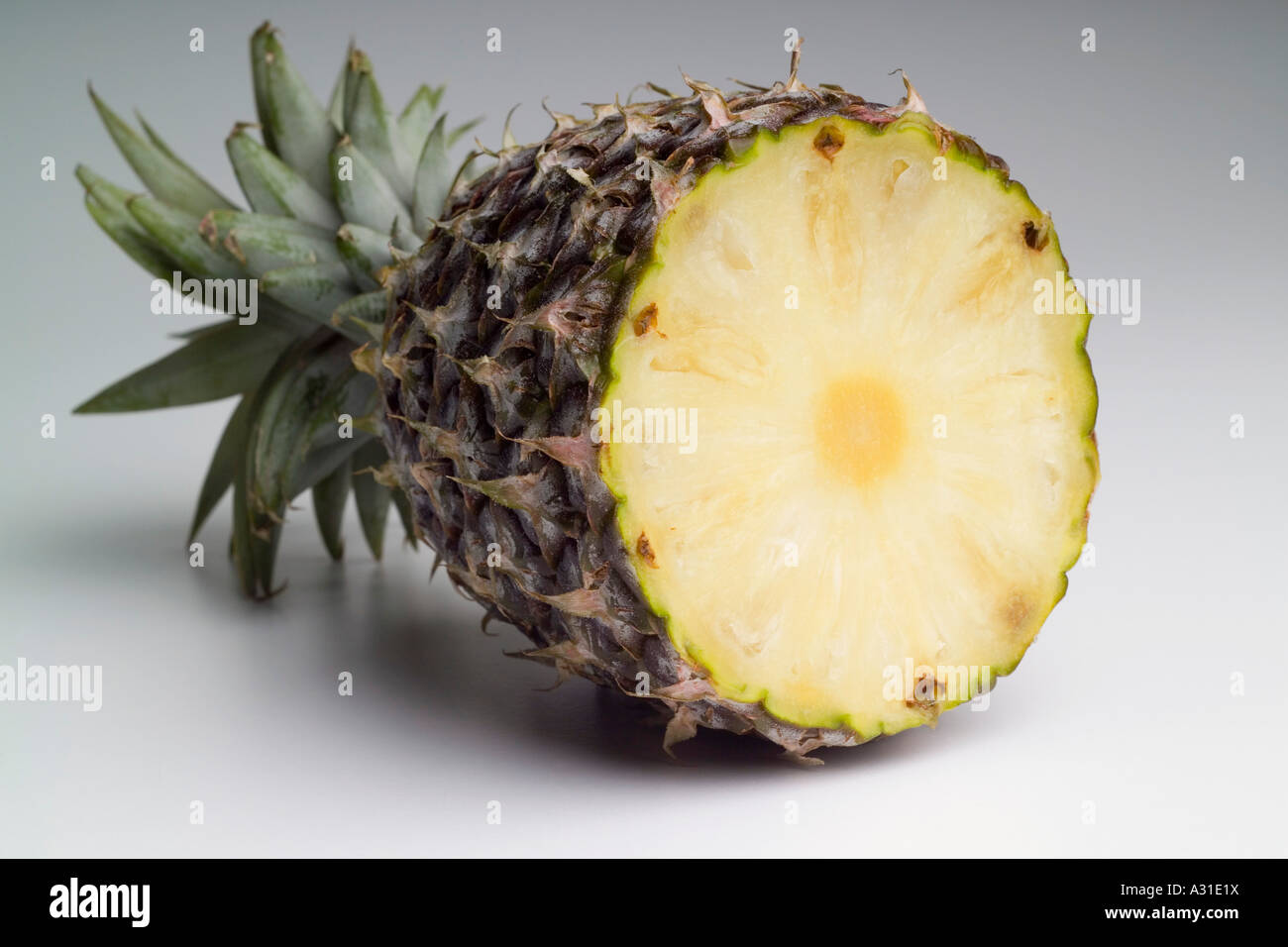 Pineapple cut in half Stock Photo - Alamy
