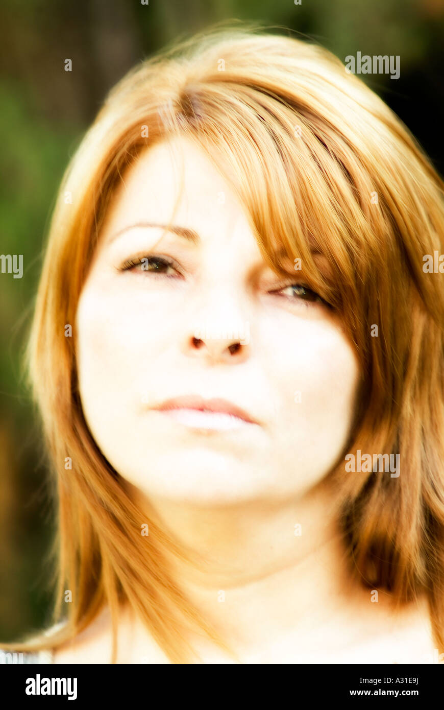 Woman looking at camera Stock Photo - Alamy
