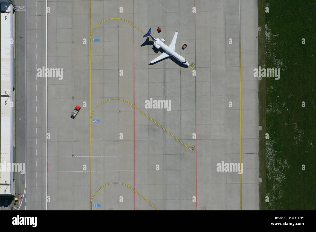 Aerial view of parked plane on airport tarmac Stock Photo - Alamy