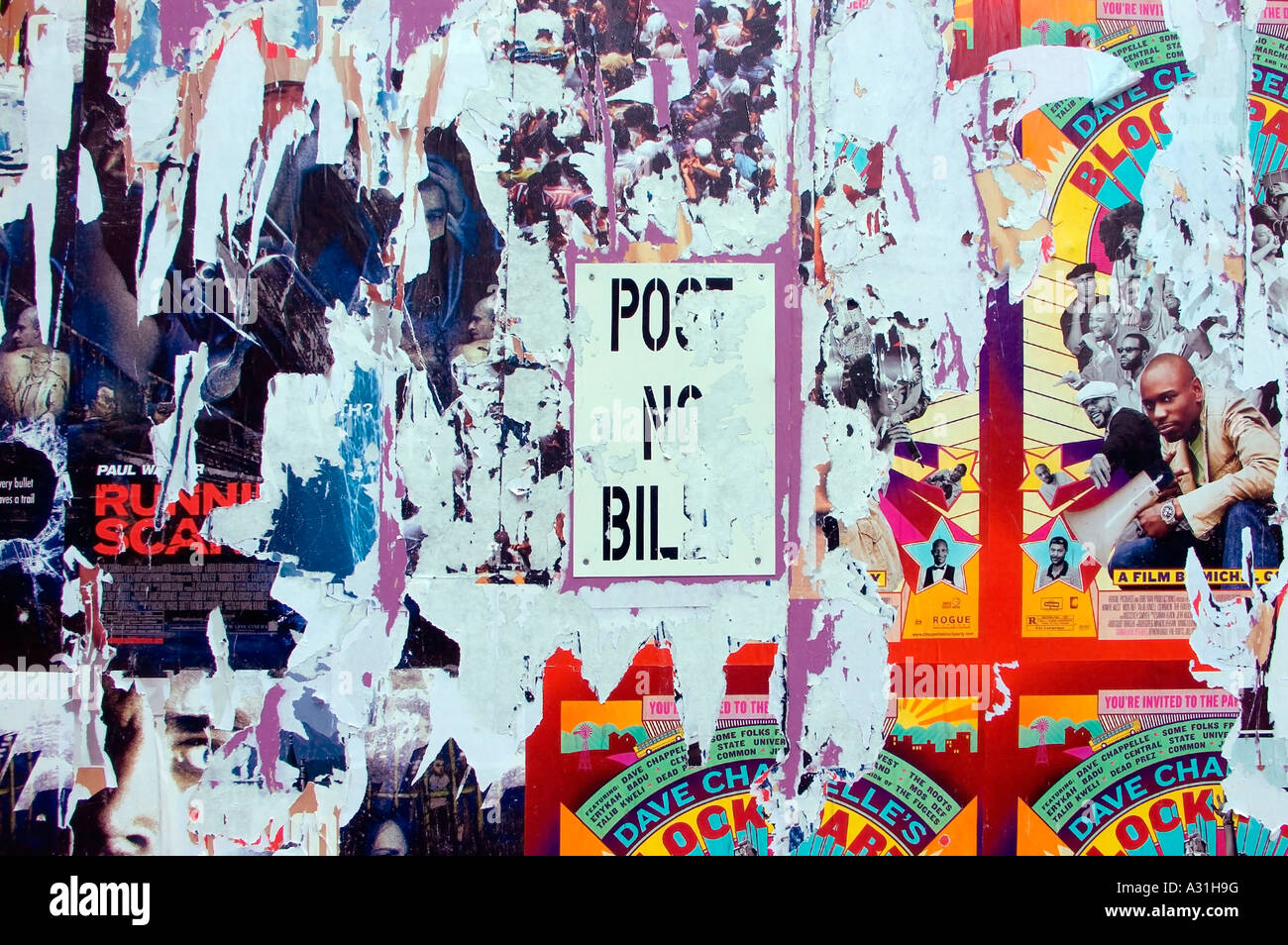 Post No Bills sign pasted over peeled posters creating abstract ...