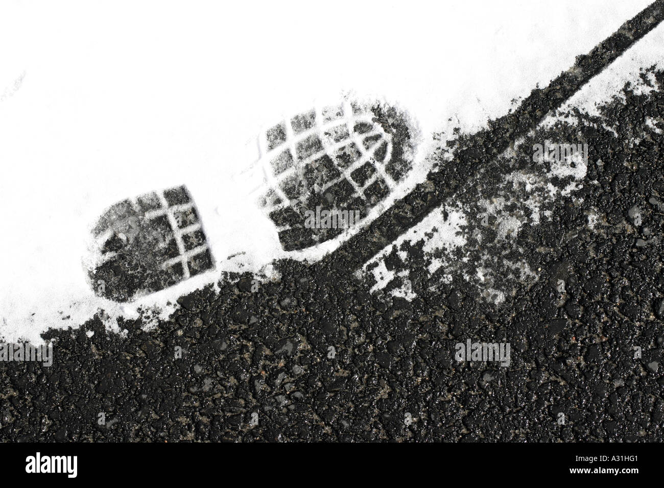Footprint of shoe in snow on road elevated view Stock Photo - Alamy