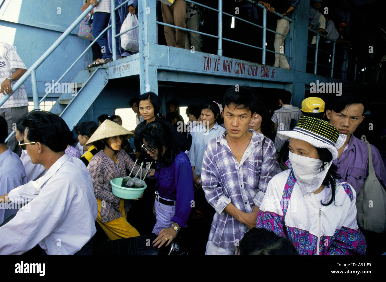 mekong delta vietnam people travel on the crowded mekong delta ferry ...