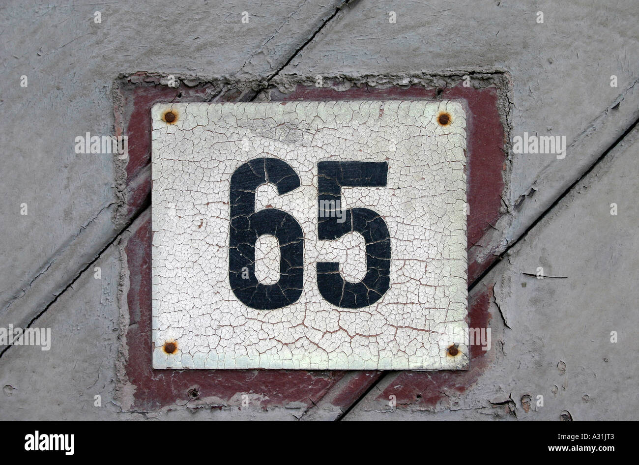 Number 65 on wall close up Stock Photo - Alamy