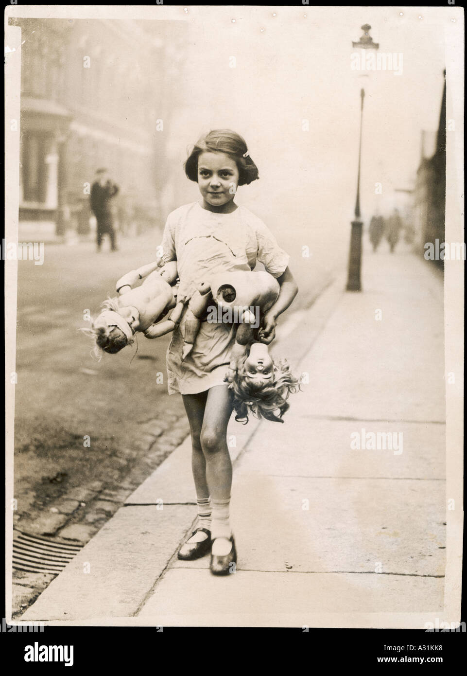 Poor girl with doll hi-res stock photography and images - Alamy