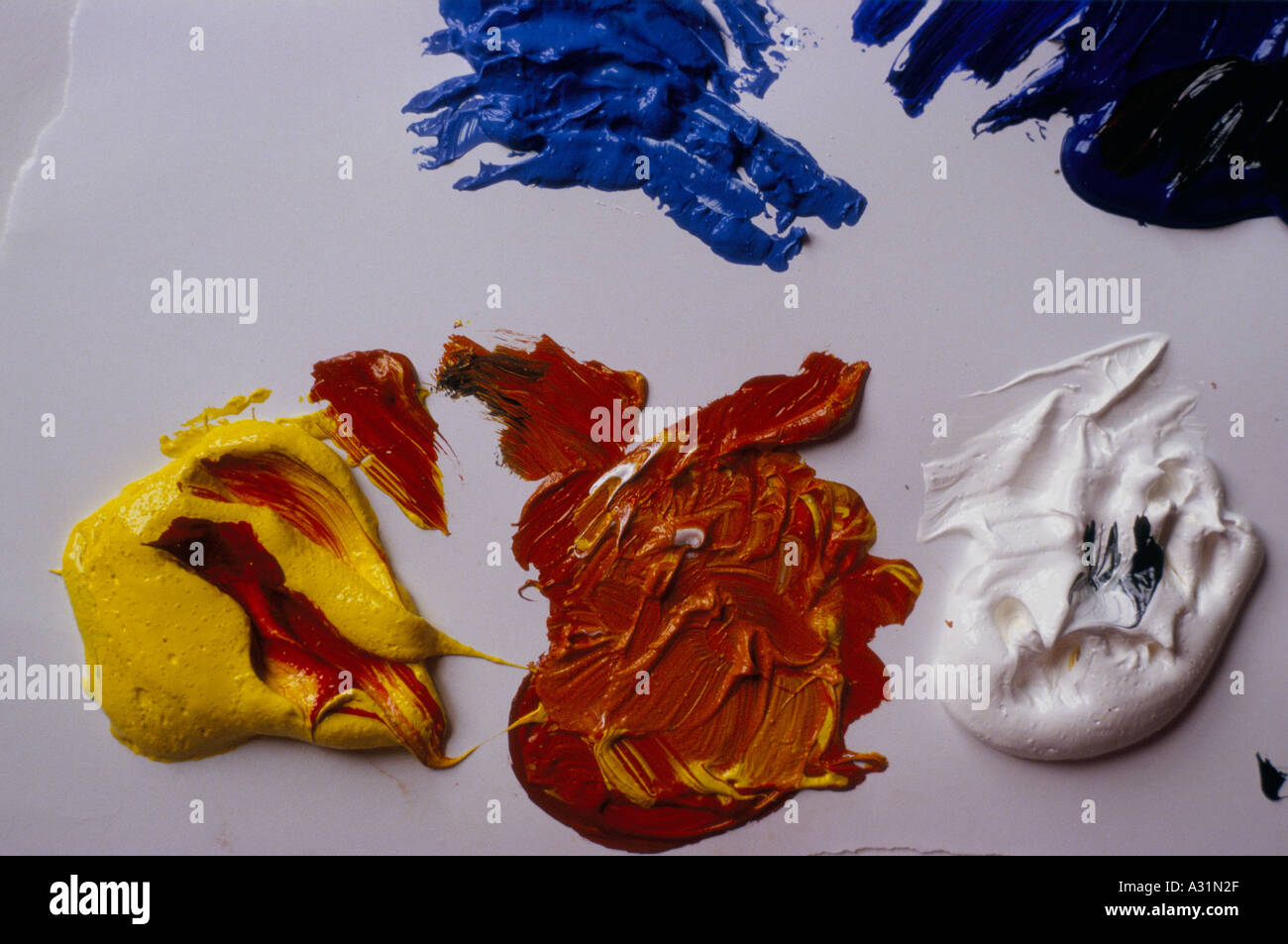 acrylic paints mixed together on artists palate Stock Photo - Alamy