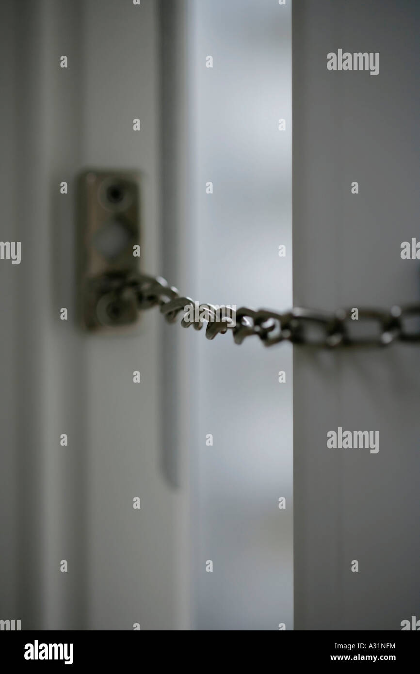 Close up of chain across open door Stock Photo - Alamy