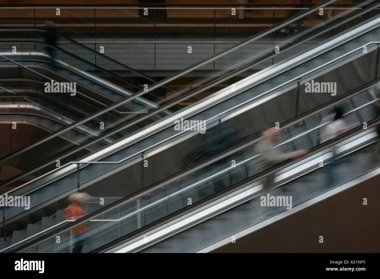 People moving up escalator Stock Photo - Alamy