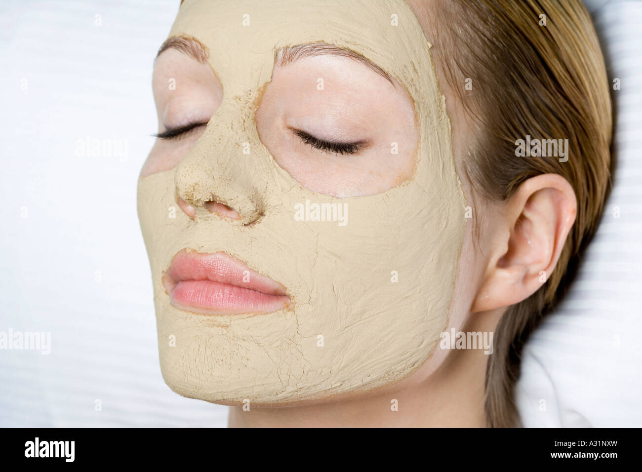 Woman relaxing and wearing a face mask Stock Photo - Alamy