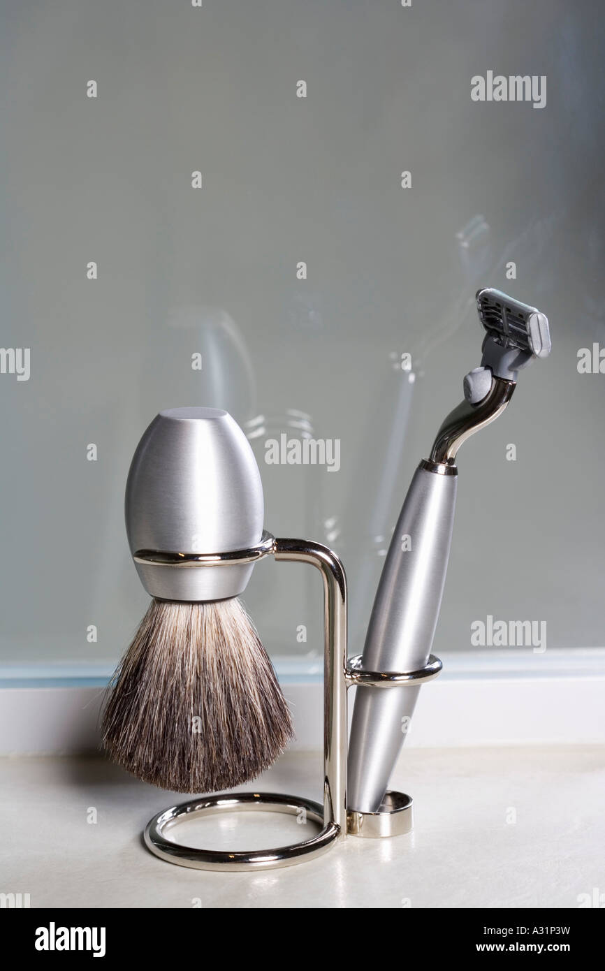 Shaving brush and razor on stand Stock Photo - Alamy