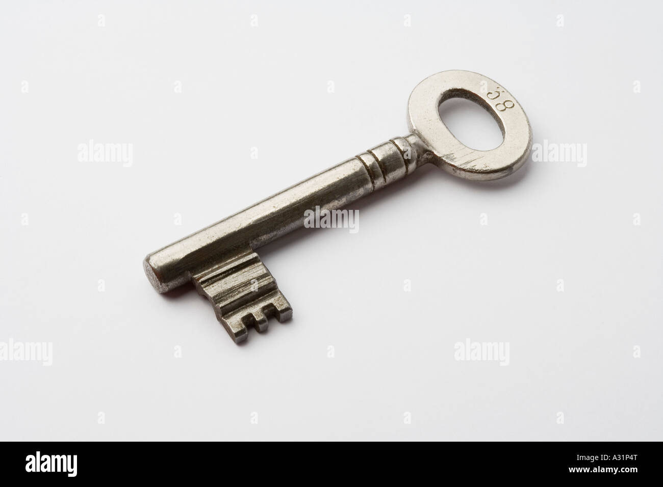 Old fashioned silver key Stock Photo - Alamy
