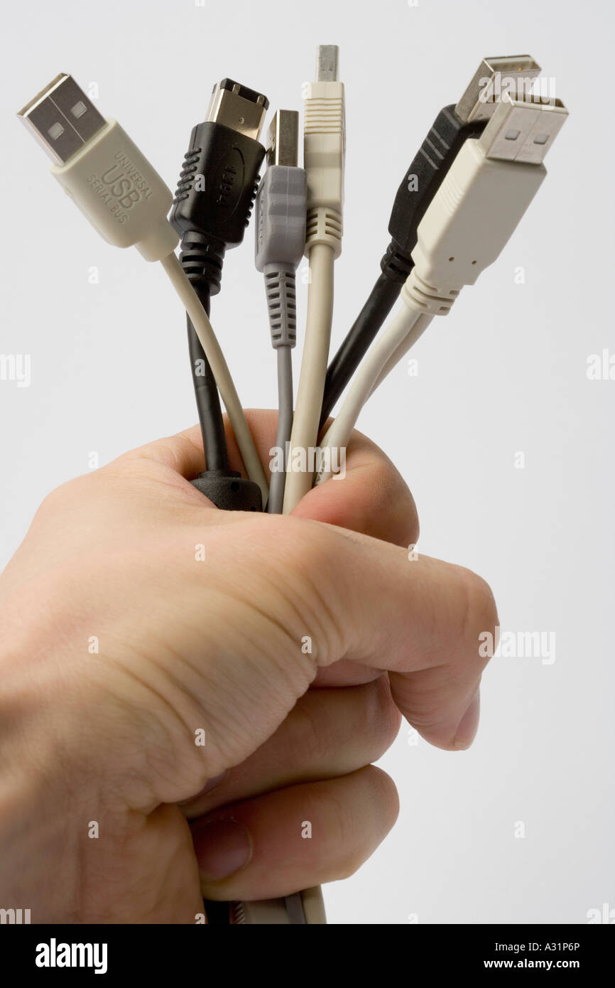 Man holding USB connector cables Stock Photo - Alamy
