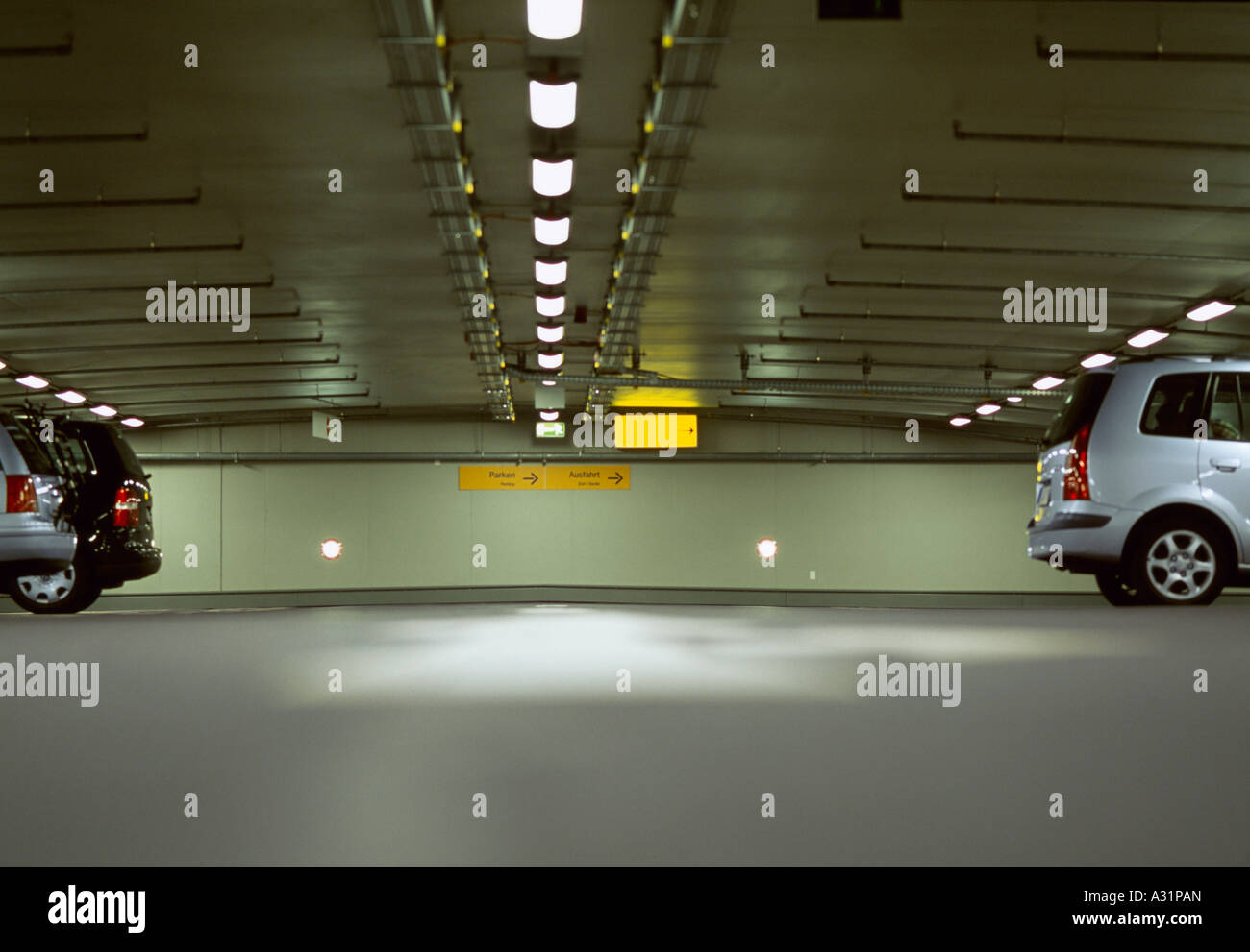 Cars in underground parking lot Stock Photo - Alamy