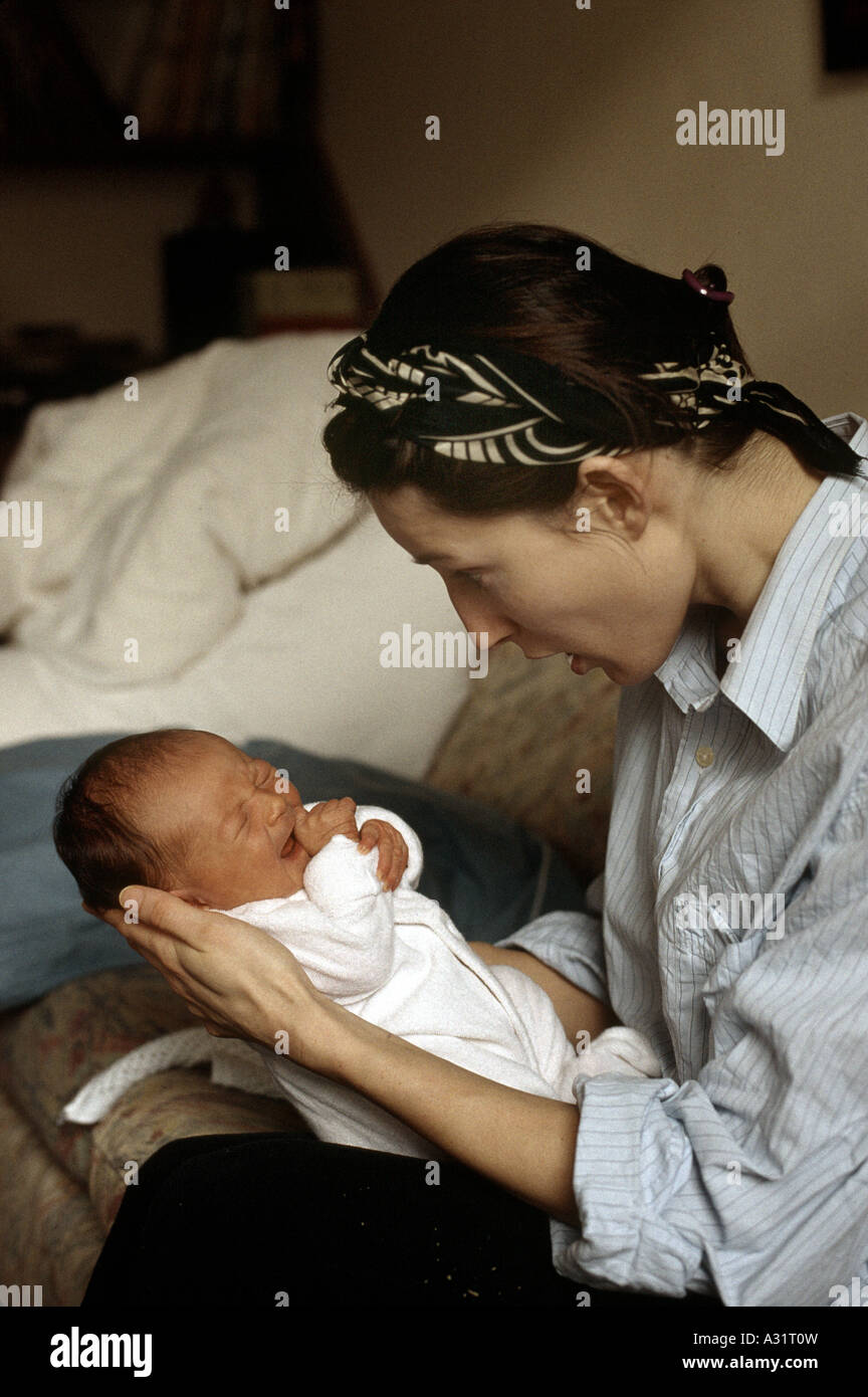mother consoling crying baby Stock Photo - Alamy