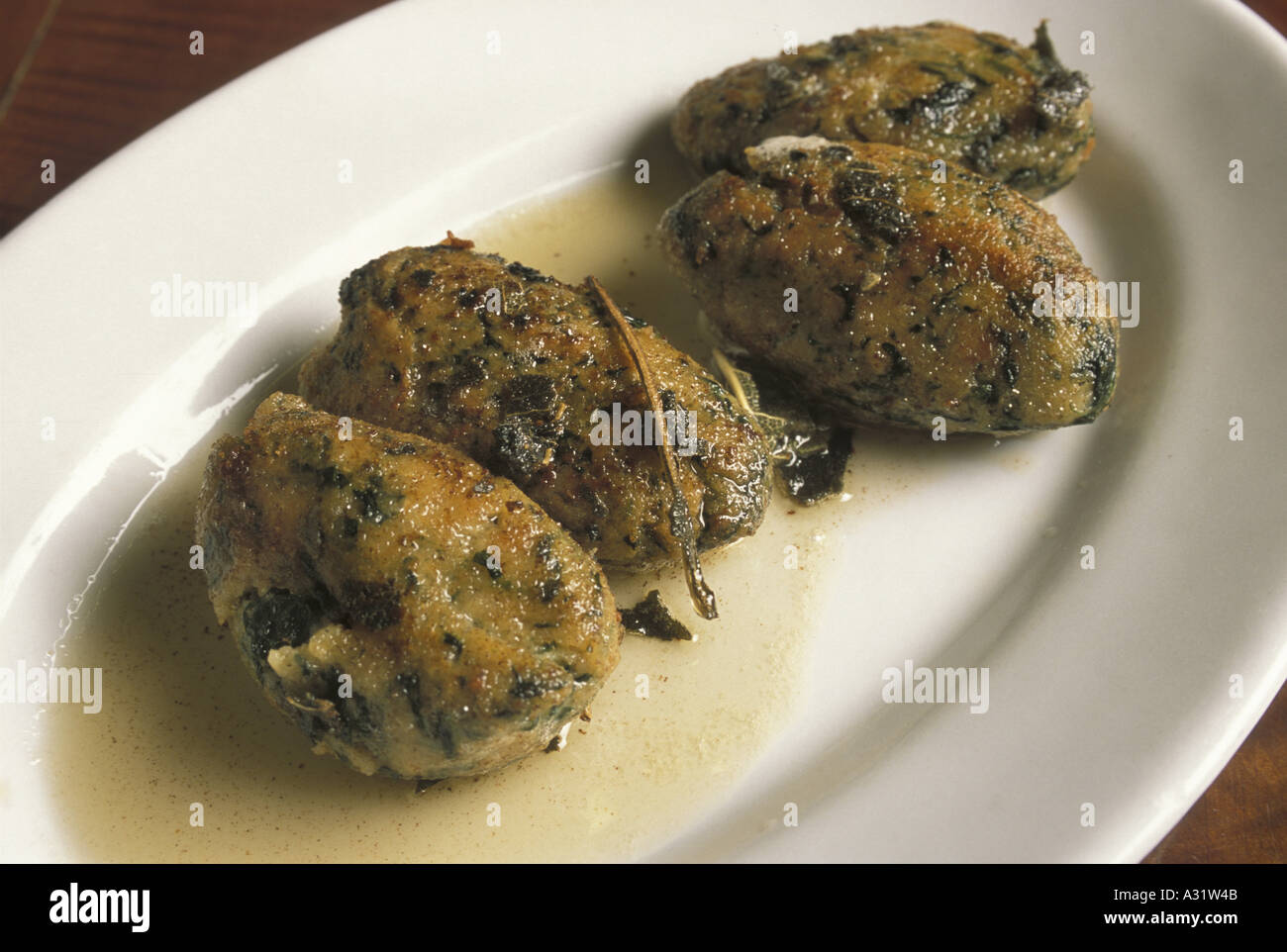 Malfatti rissoles with melted butter spinach and sage Al Bianchi ...