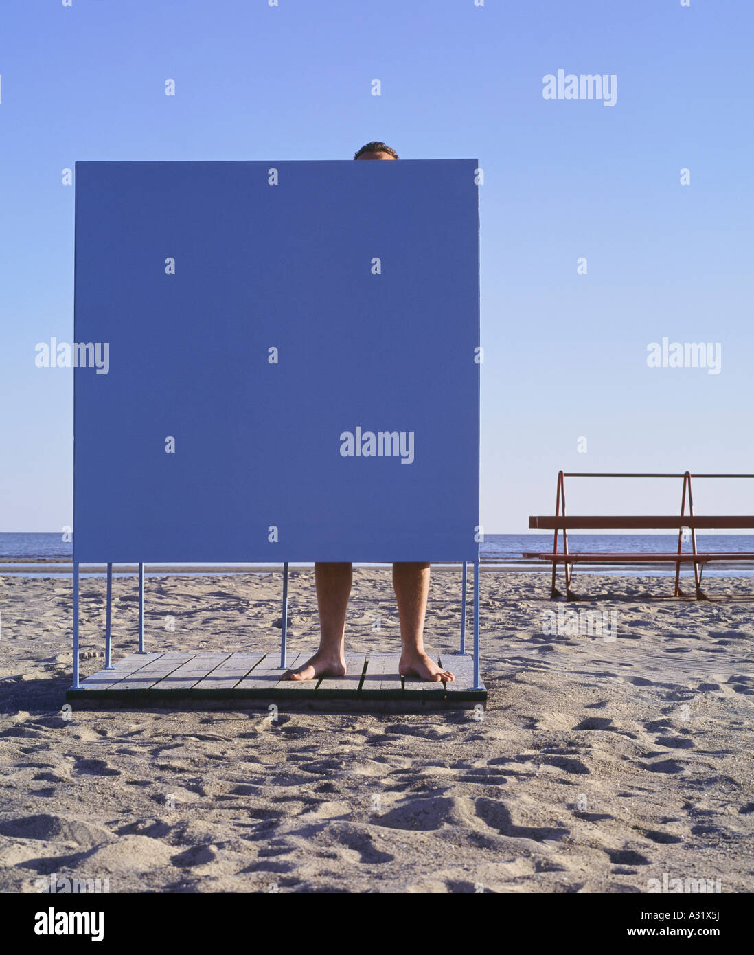 Man changing on a beach hi-res stock photography and images - Alamy