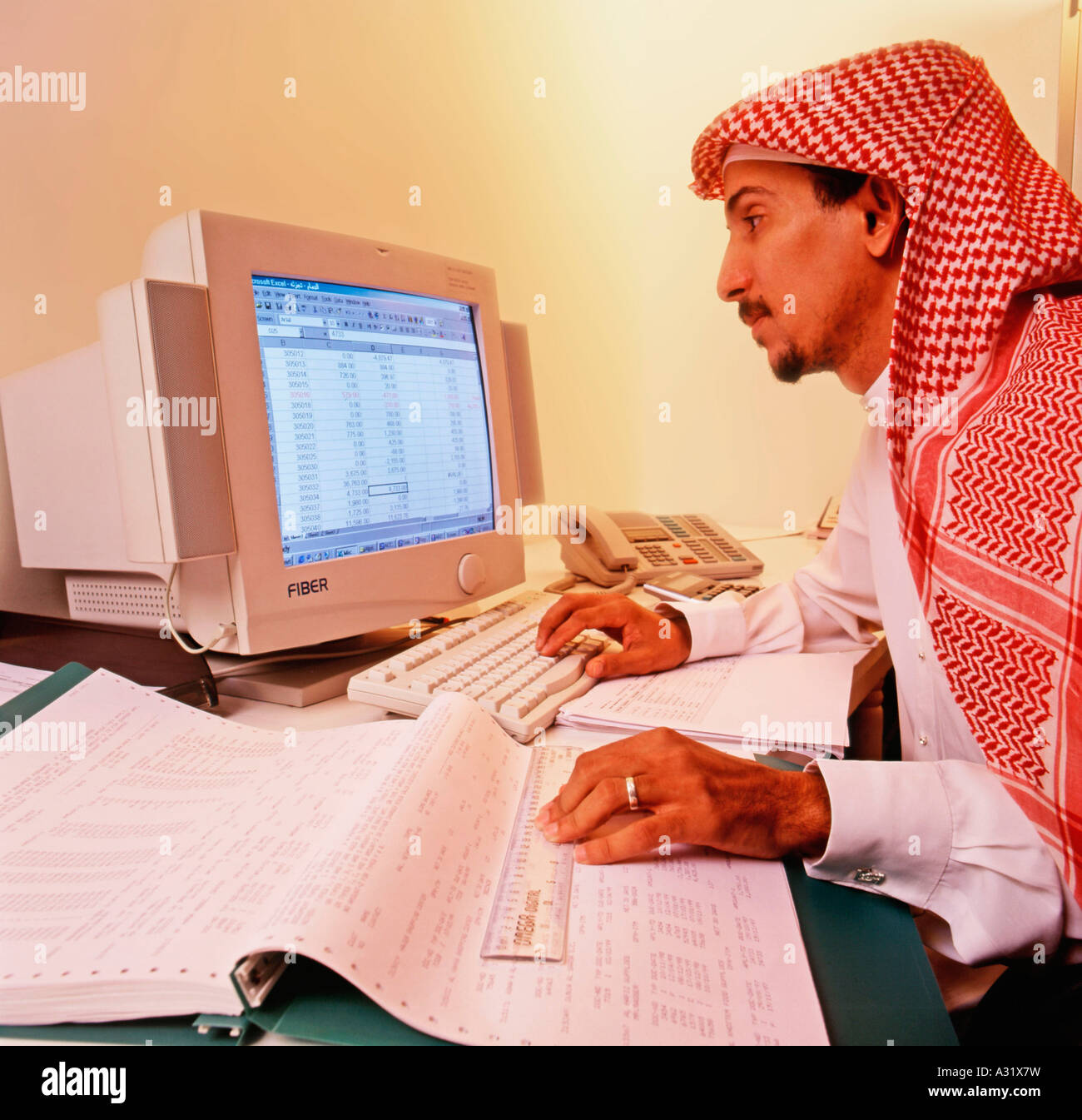 Saudi accountant with computer Stock Photo - Alamy