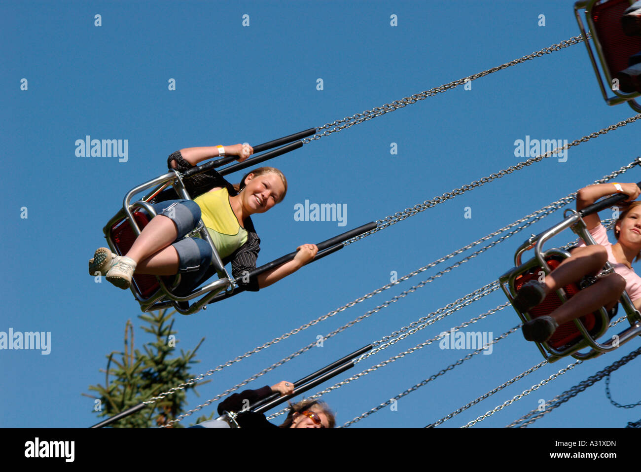 Children riding a merry go round Stock Photo - Alamy