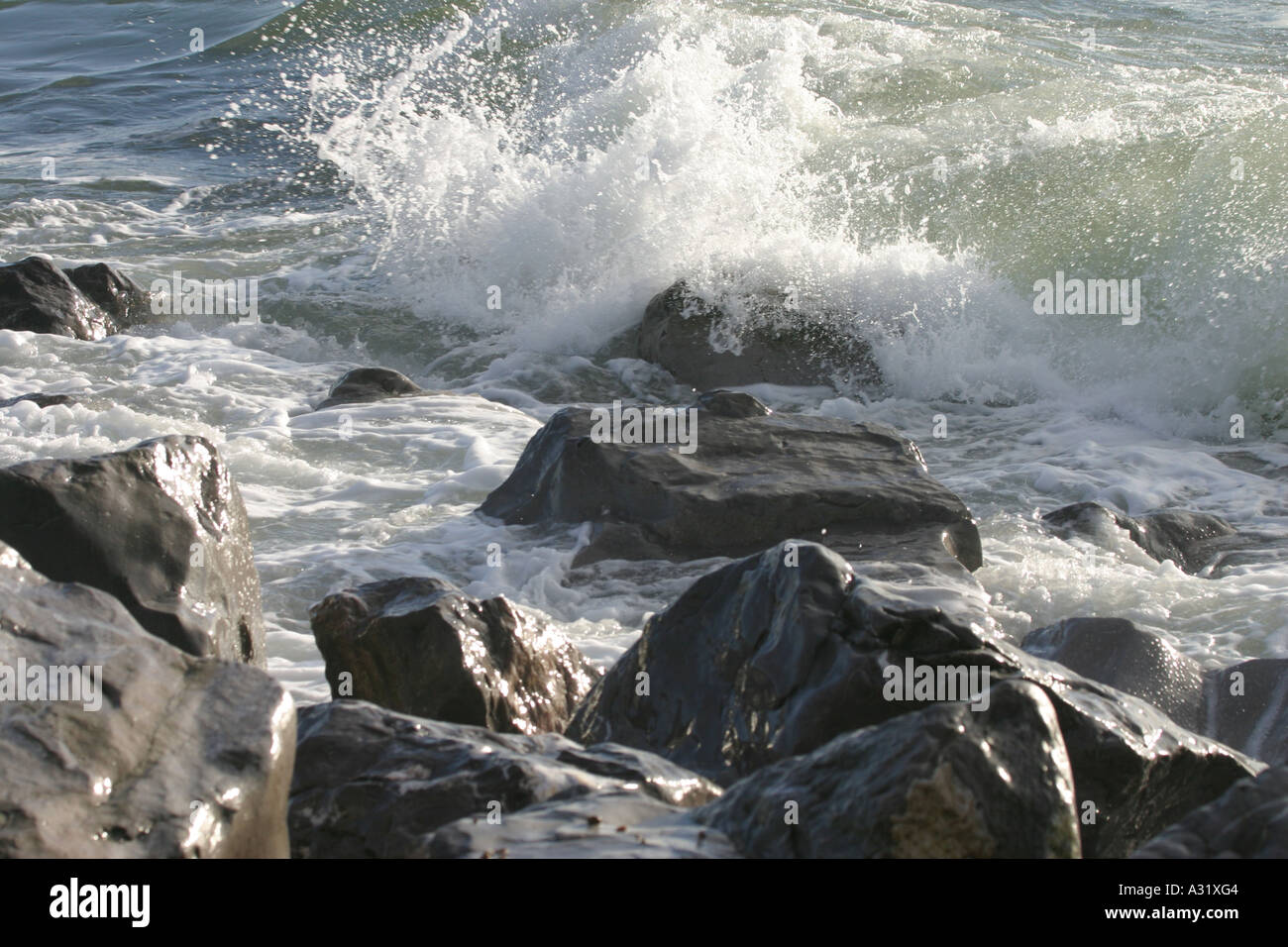 sea crashing against rocks Stock Photo - Alamy