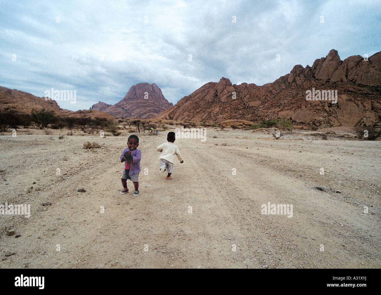 Two Children Playing, Spitzkoppe Region, Namibia, Africa Stock Photo ...