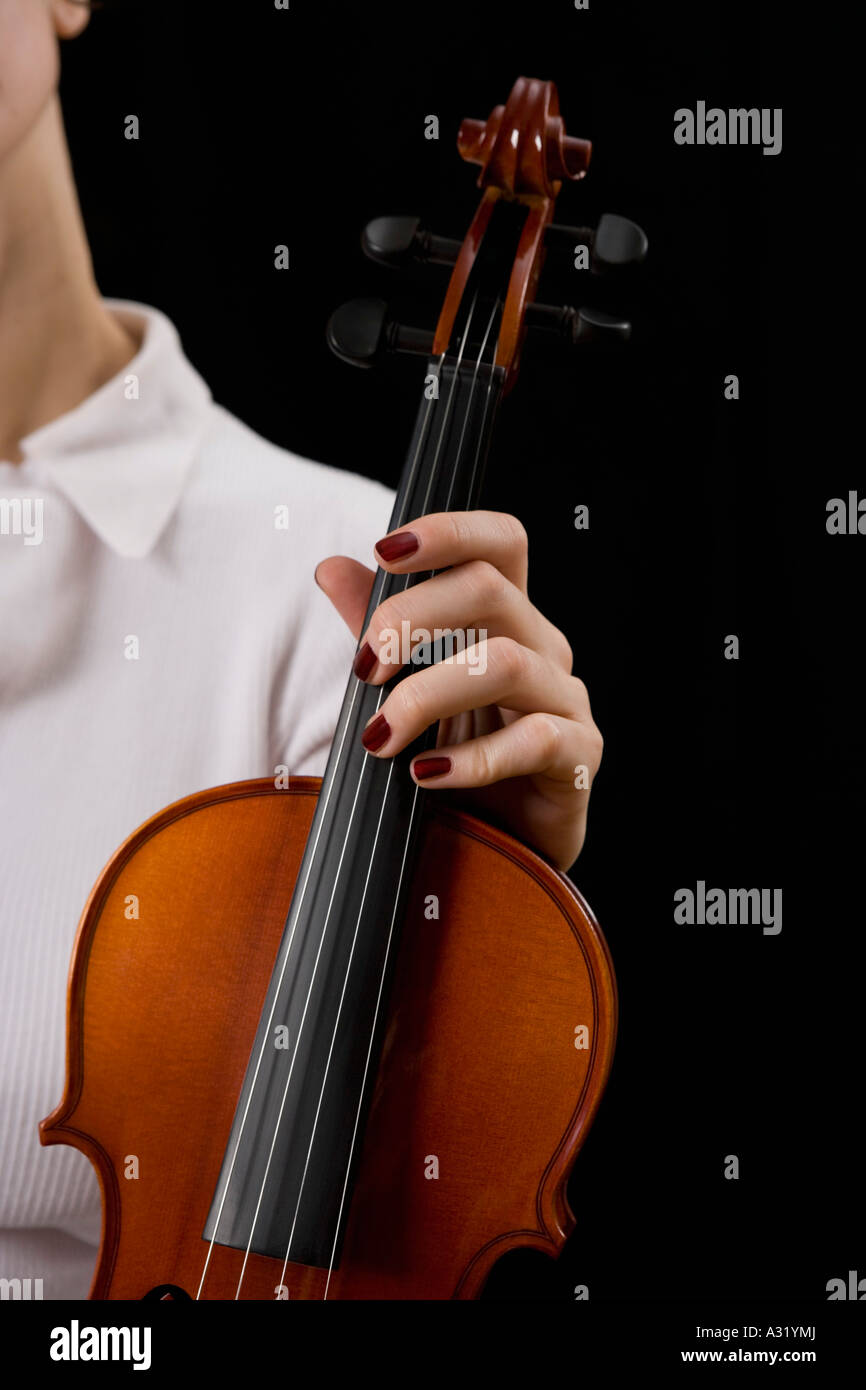 Woman holding a violin Stock Photo - Alamy