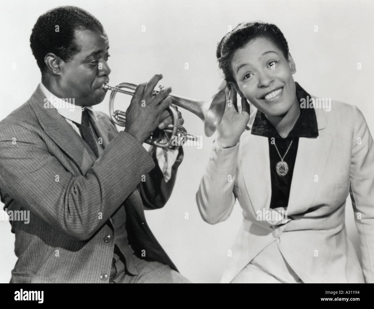 LOUIS ARMSTRONG and Billie Holiday in a promotional photo for the 1947 ...