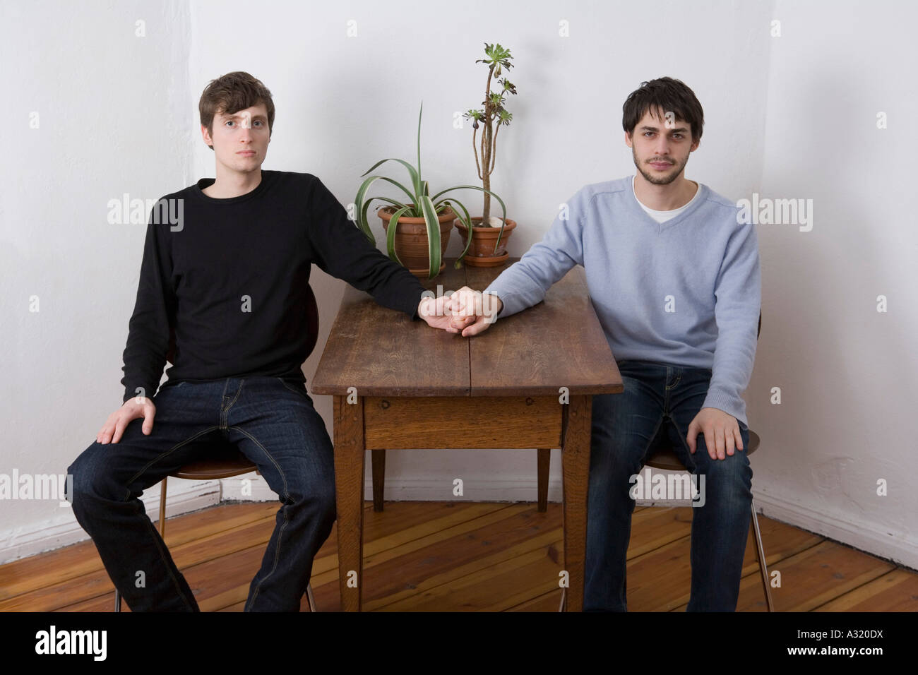 Holding Hands Across Table High Resolution Stock Photography and Images ...