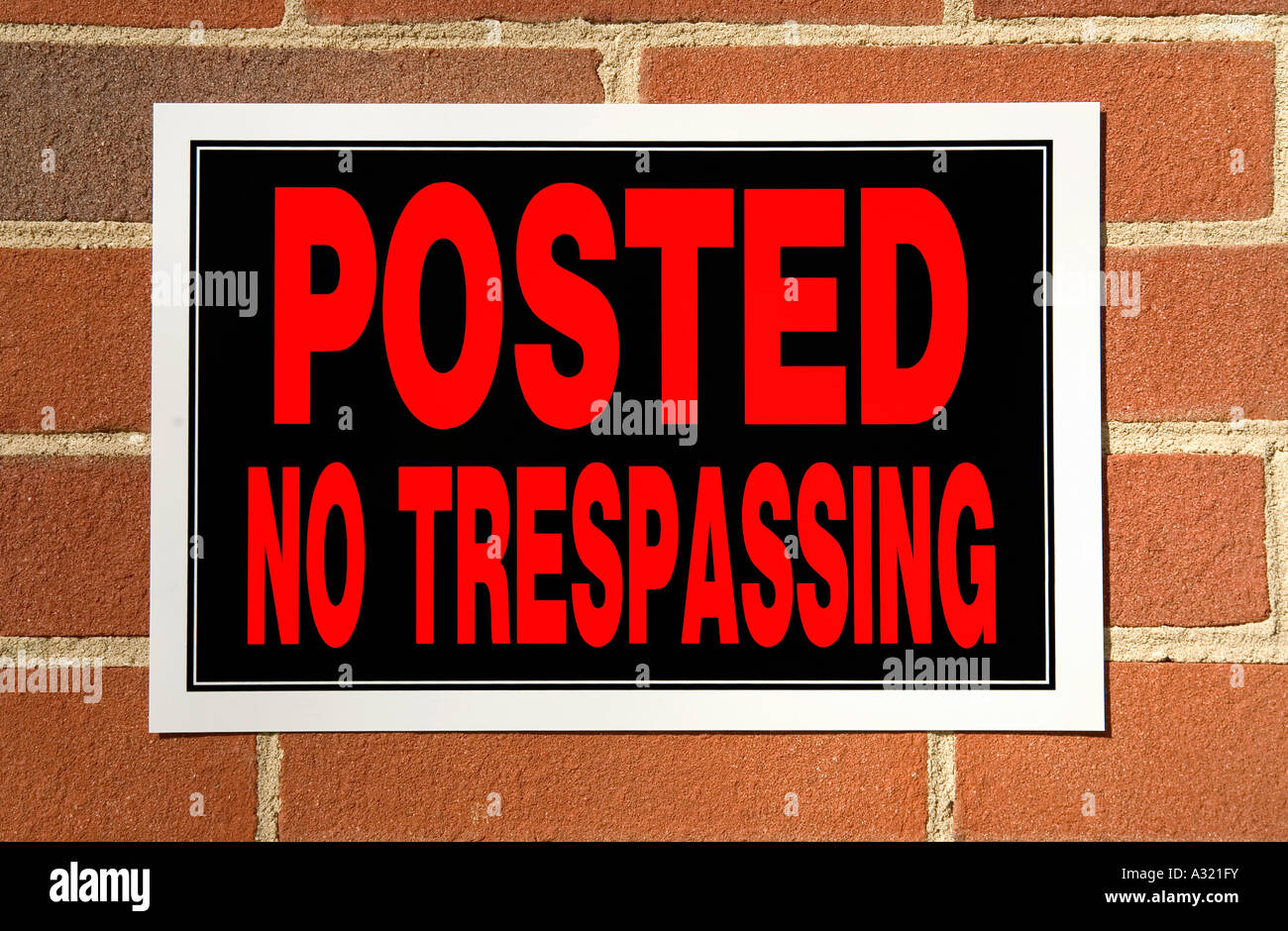 Posted No Trespassing sign Stock Photo - Alamy