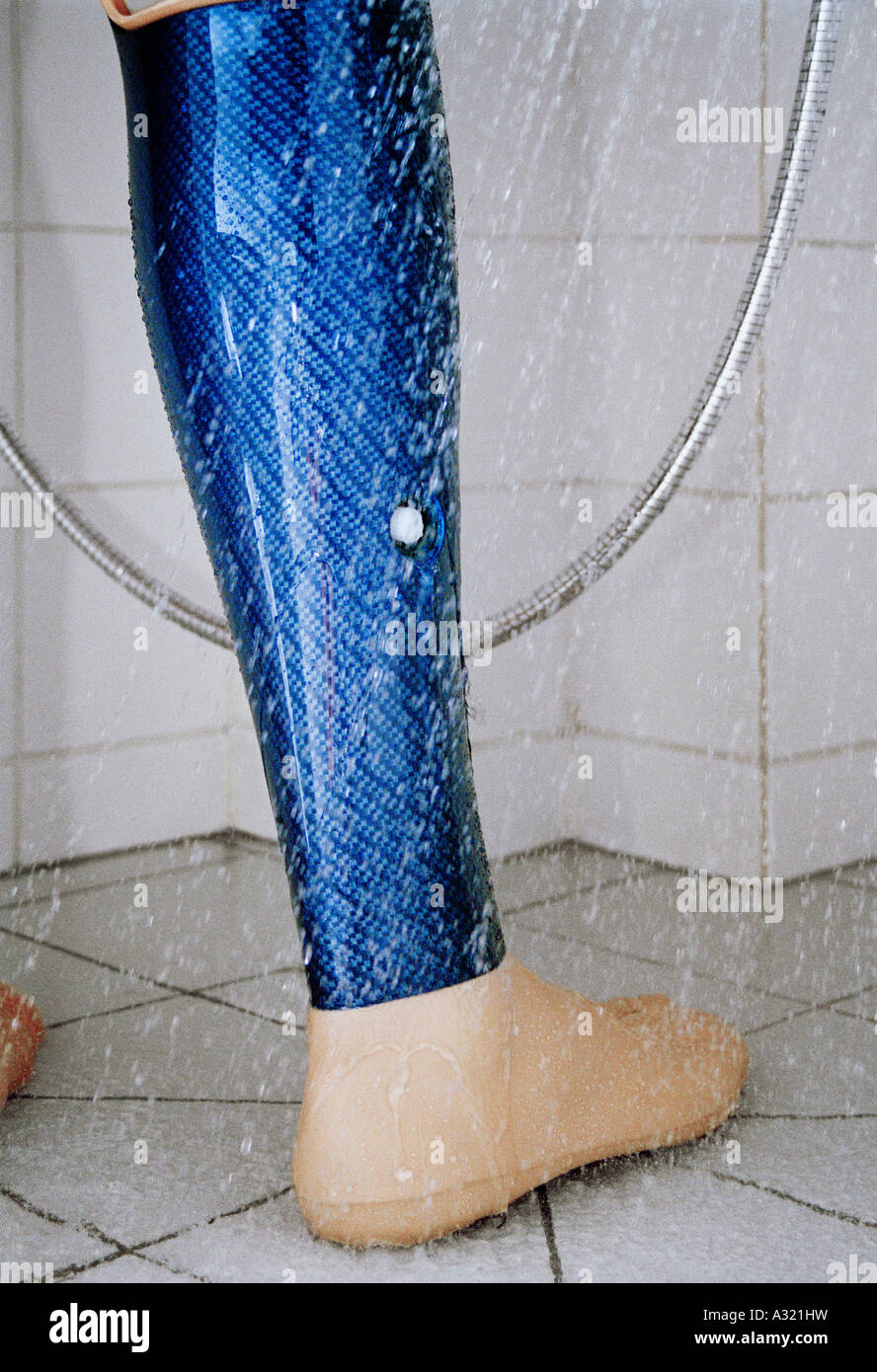 Low section of person standing in shower with prosthetic leg Stock ...