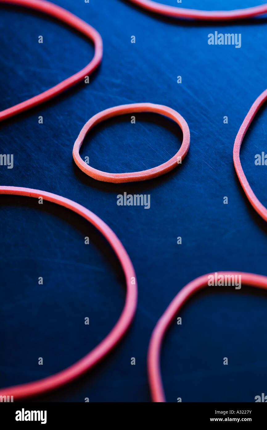 Rubber bands on a desk Stock Photo - Alamy