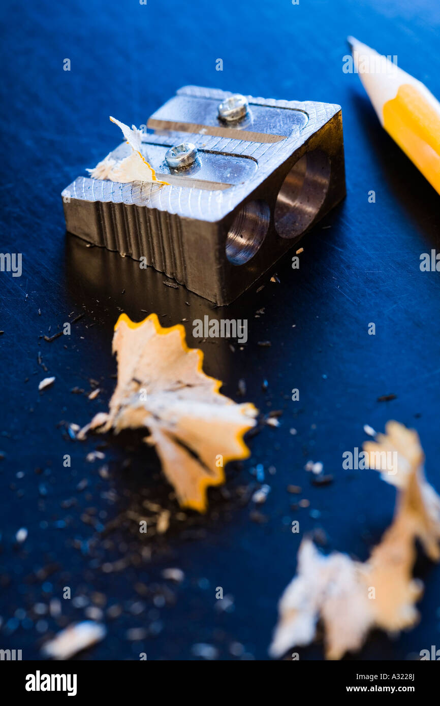 Pencil sharpener shavings and pencil on a desk Stock Photo - Alamy