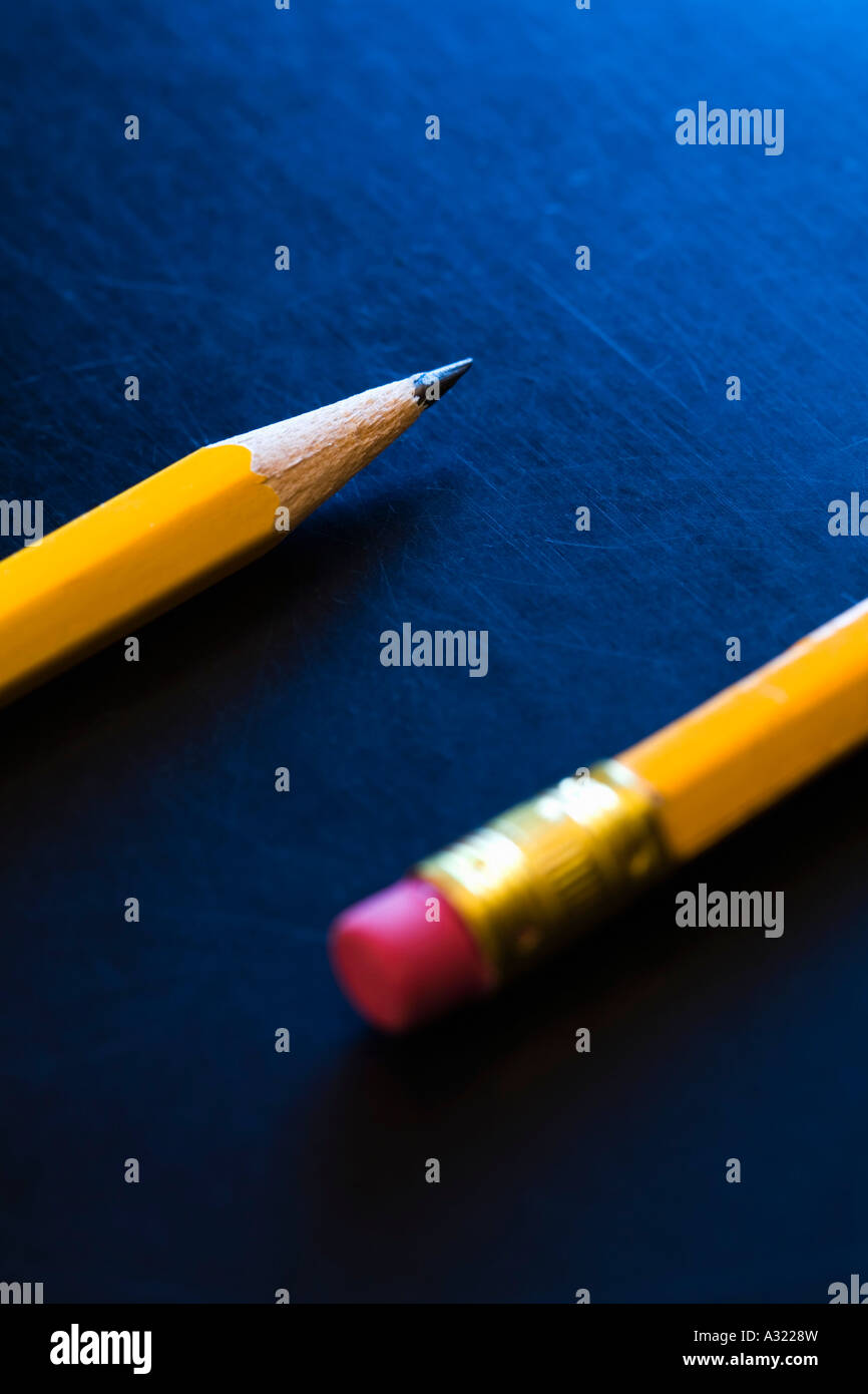 Two pencils on a desk Stock Photo - Alamy