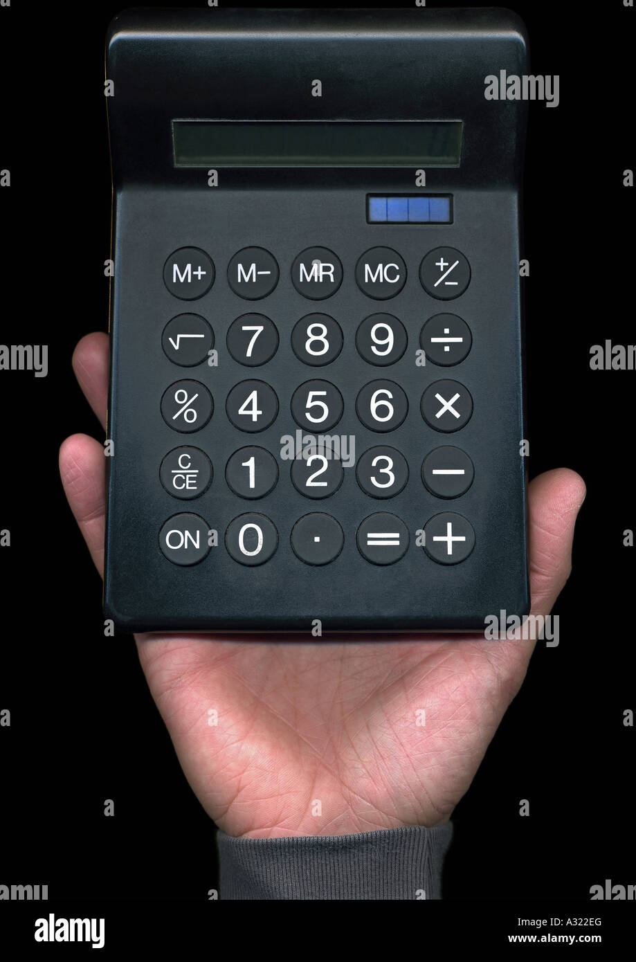 Man holding a calculator Stock Photo - Alamy