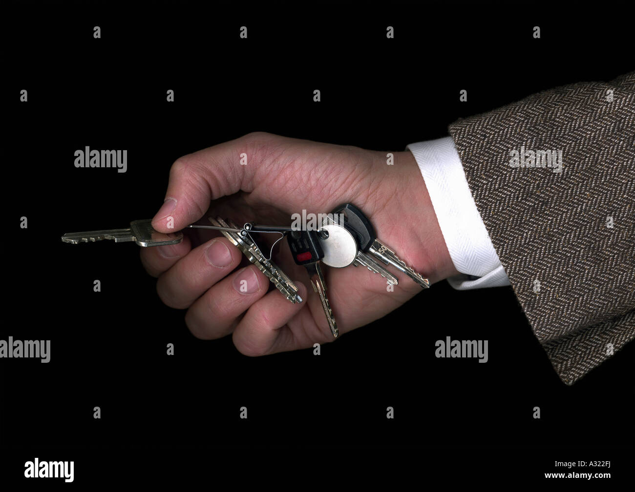 Man holding a set of keys Stock Photo - Alamy