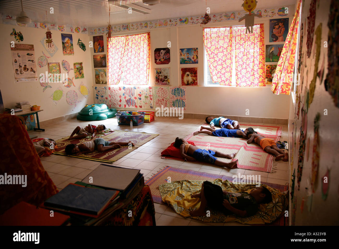 School children taking nap Hanavave Island of Fatu Hiva Marquesas ...
