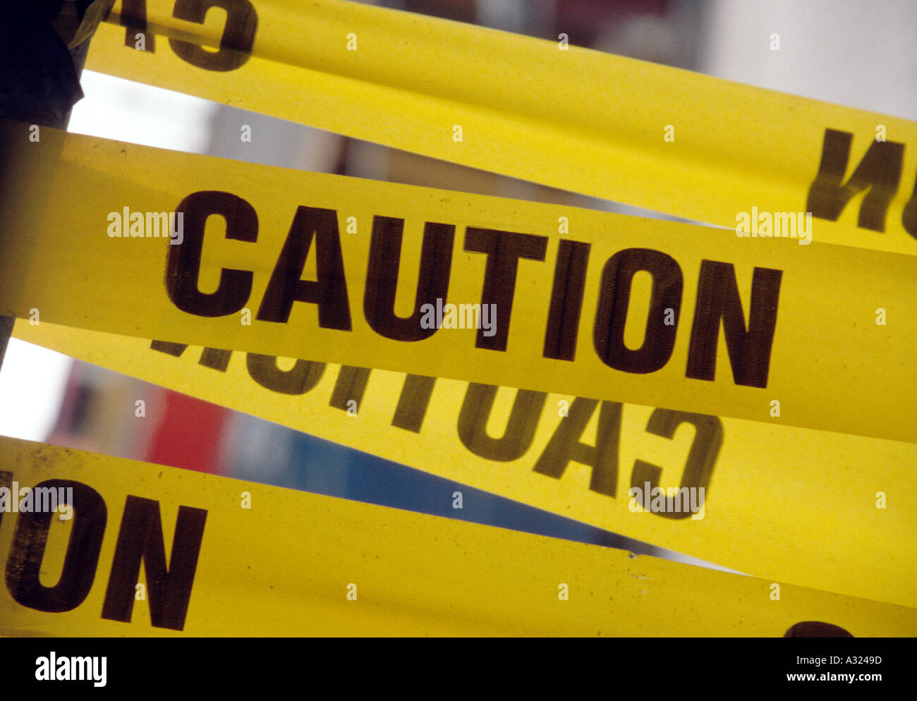 Still life of several pieces of yellow tape that read caution Stock ...