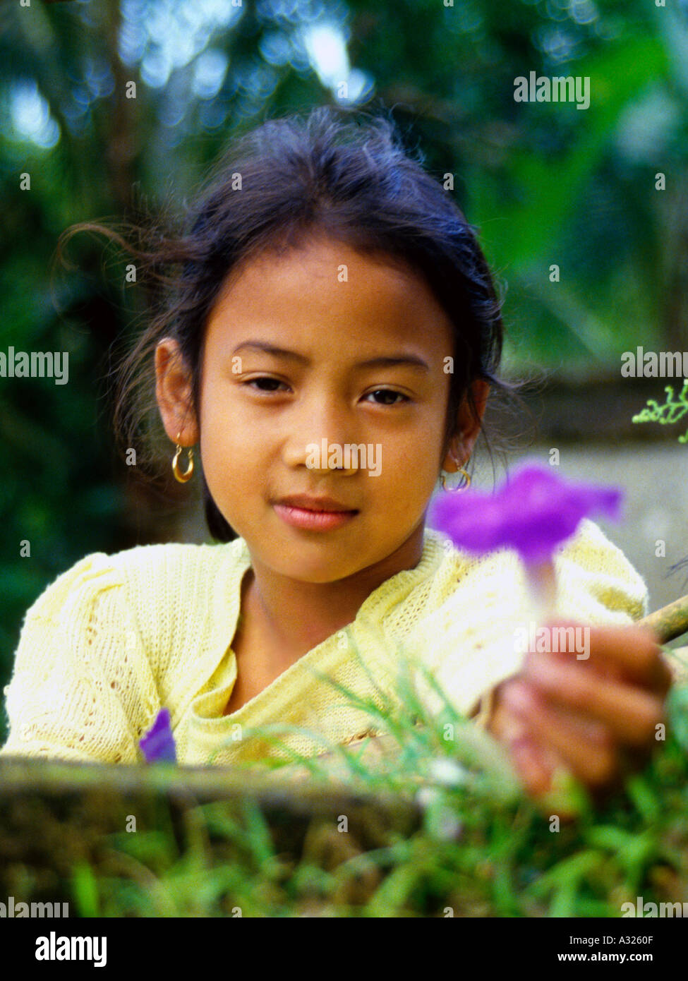 Child offering flower hi-res stock photography and images - Alamy