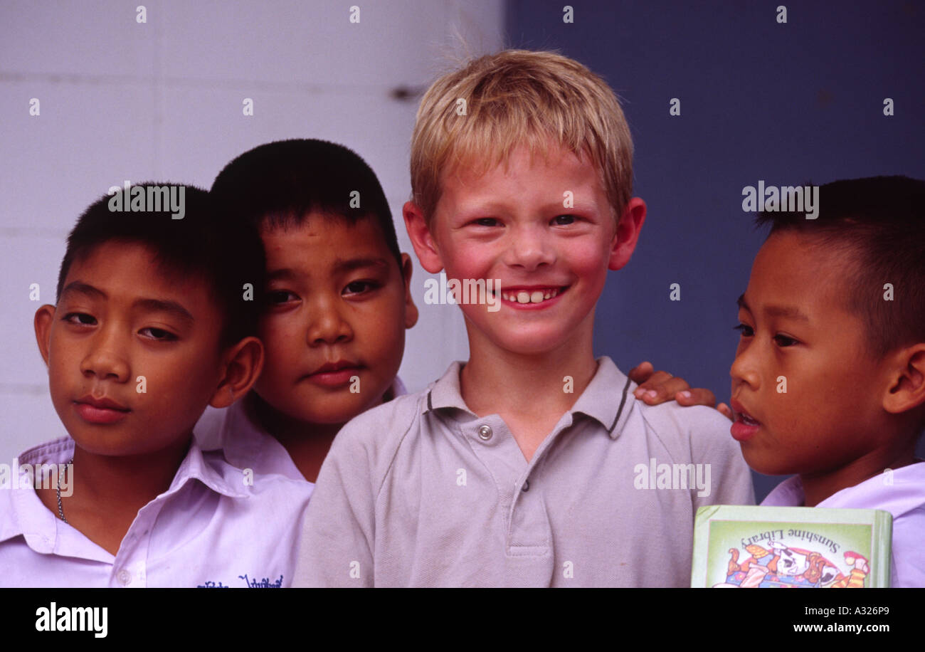 British boy with Thai friend schoolboys at Koh Samet school, Thailand ...