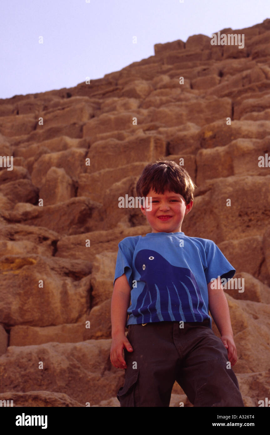 Vertical portrait of small British child tourist standing by the ...