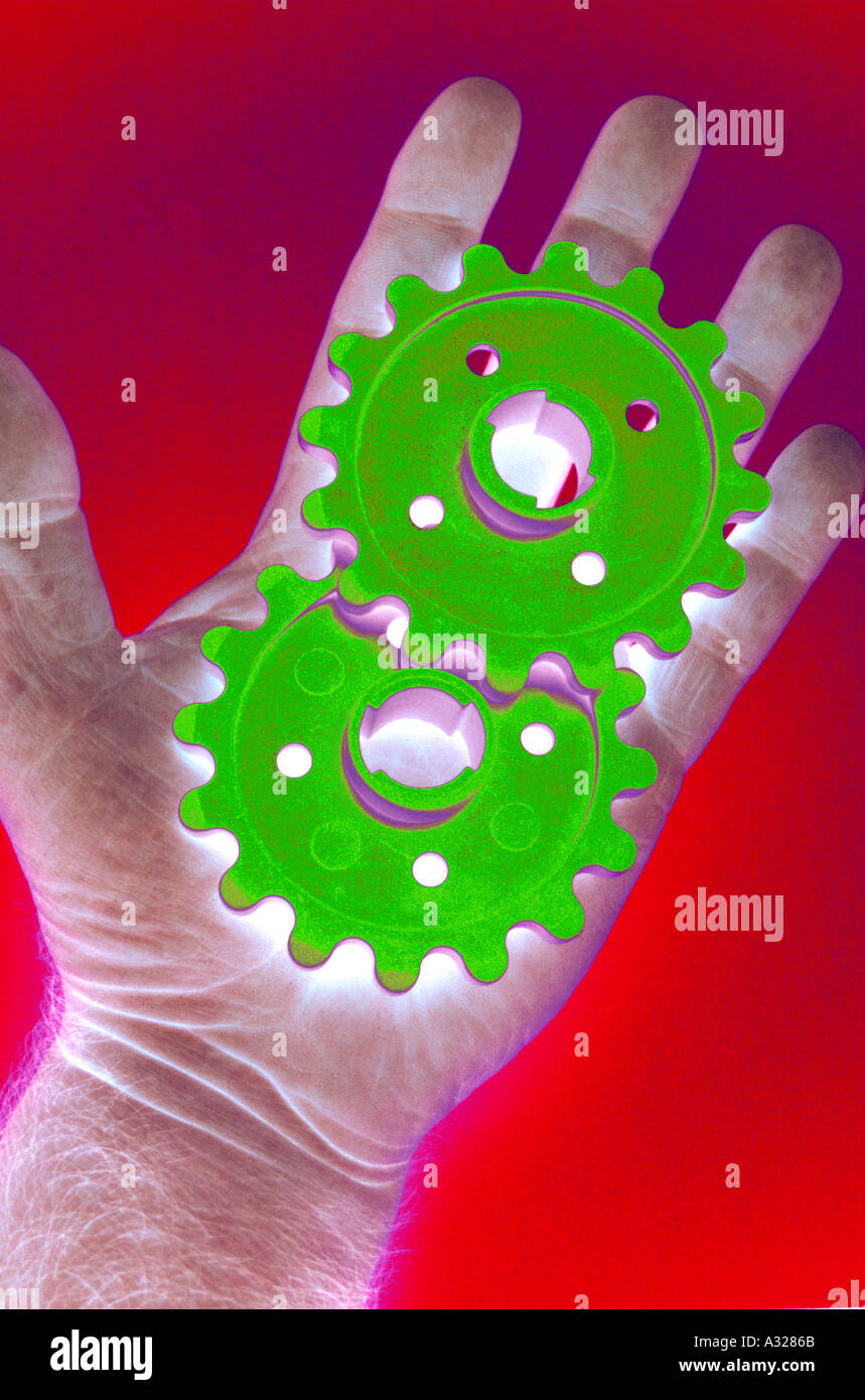 People hands cogs gears hi-res stock photography and images - Alamy