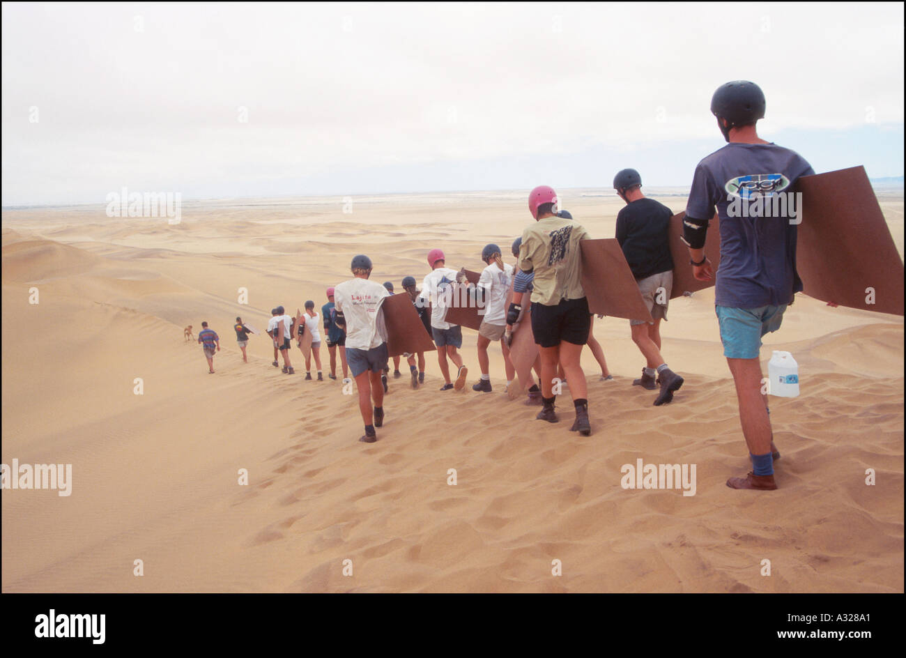 NAMIBIA Tourists body surfing on sand Stock Photo - Alamy