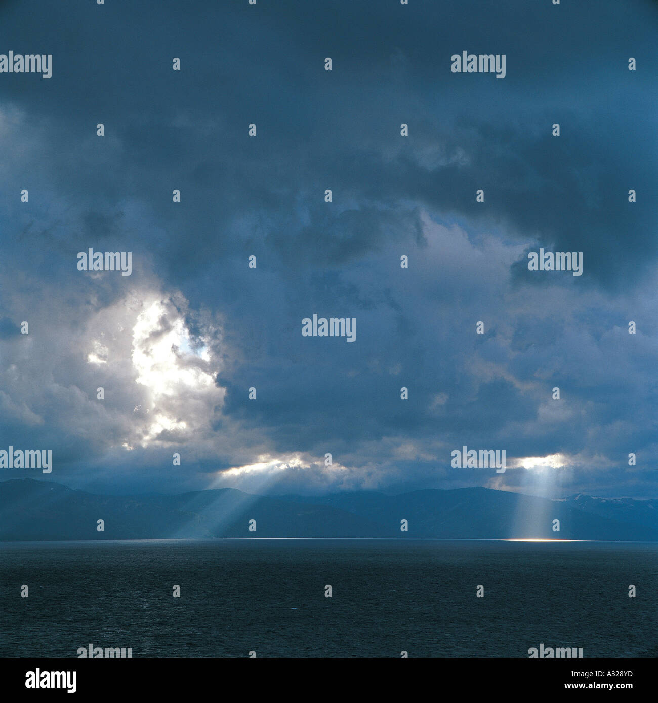 The sun beams shining on the sea Stock Photo - Alamy