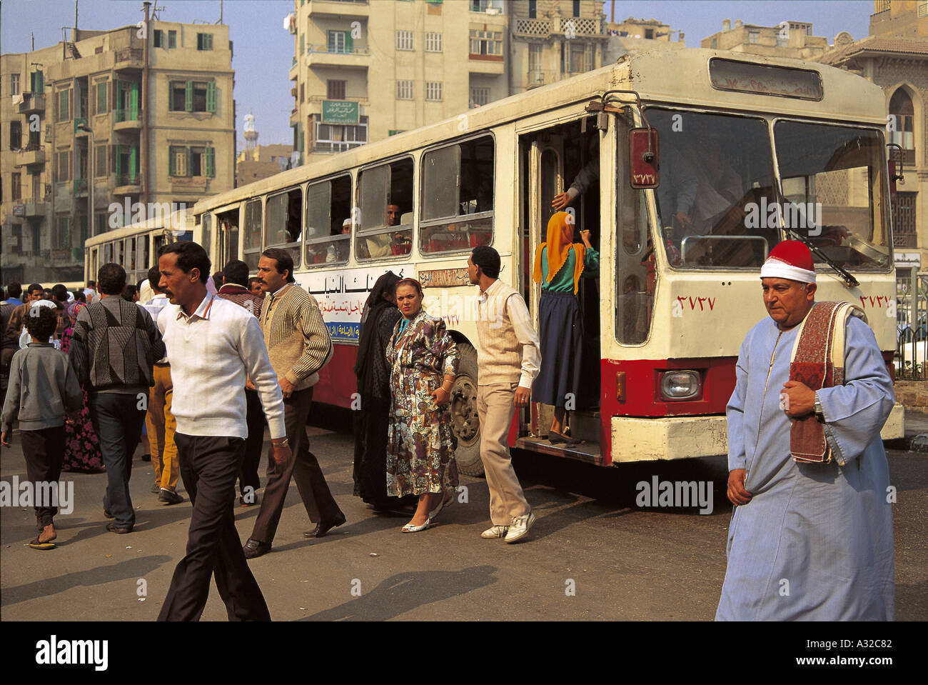 Urban scene with bus and people in central Cairo, Egypt Stock Photo - Alamy