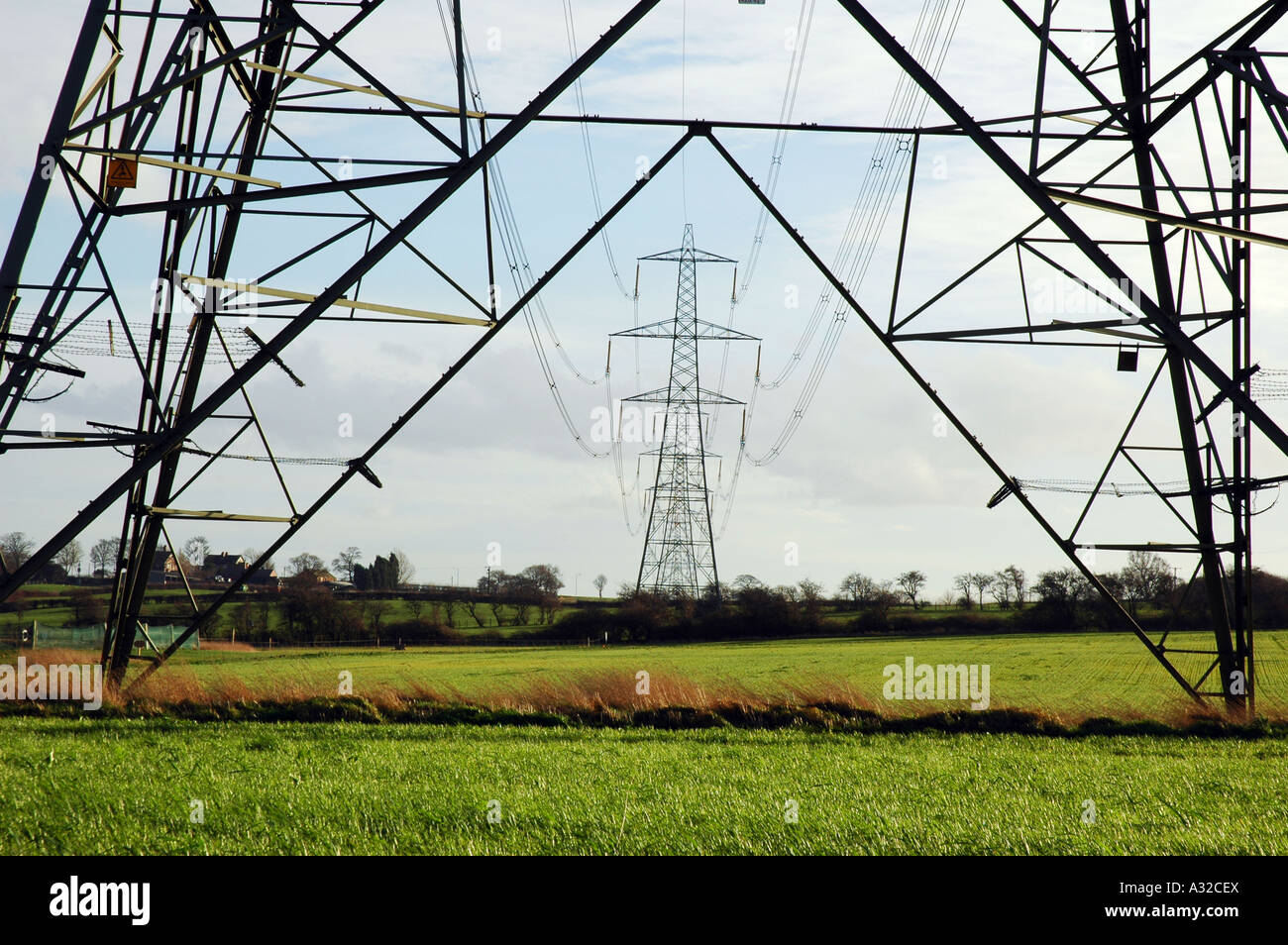 Electricity pylon framed by and viewed from the base of a pylon Stock ...