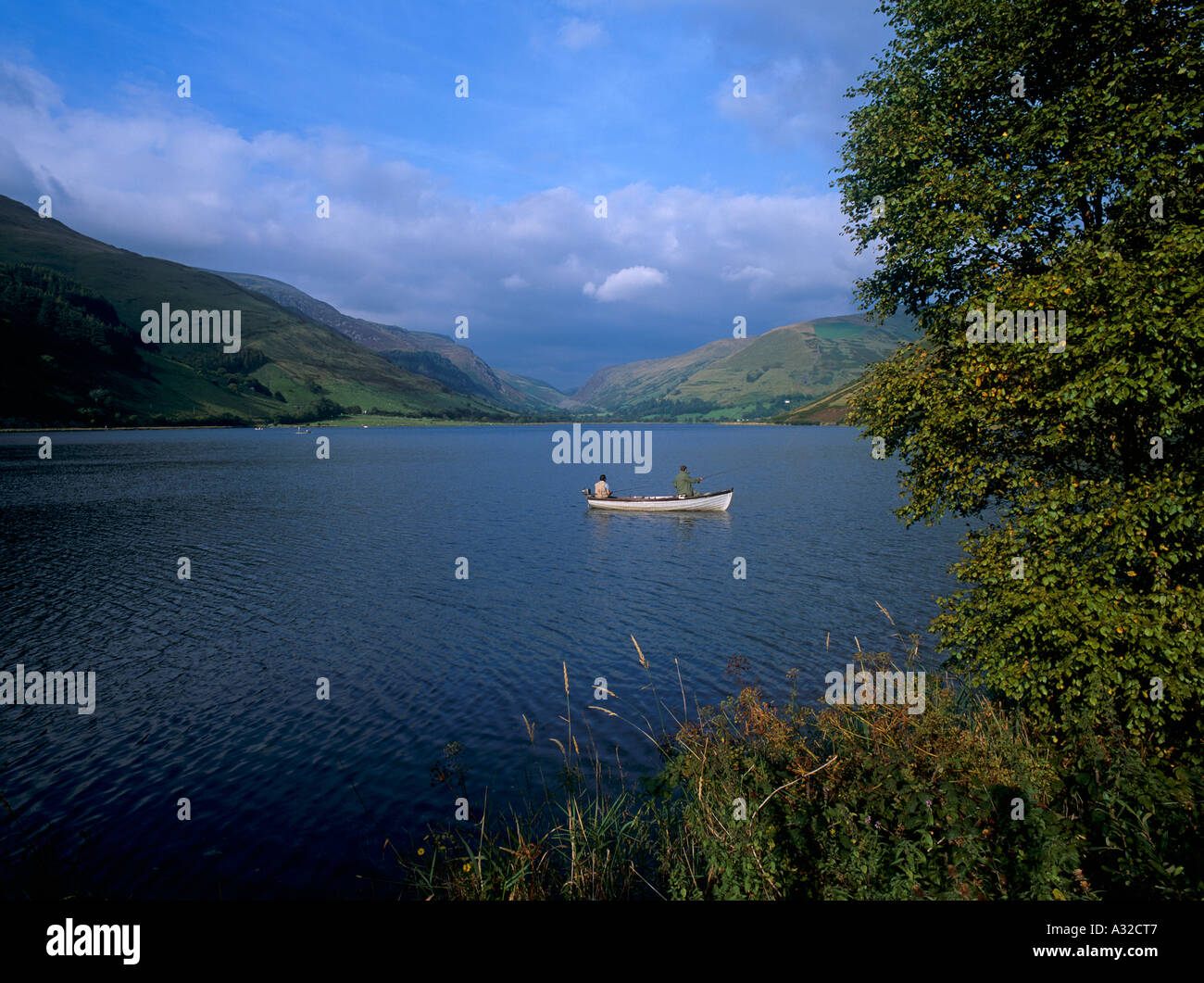 Fishermen in boat on lake Tal Y Llyn Snowdonia National Park North ...